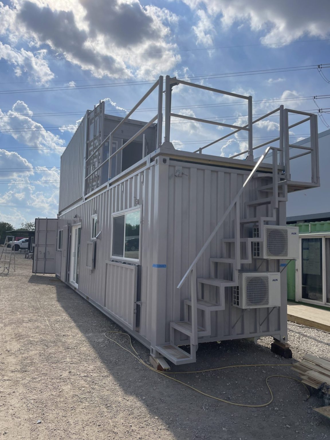 STACKED MULTI-UNIT SHIPPING CONTAINER HOME - HIG HOUSE